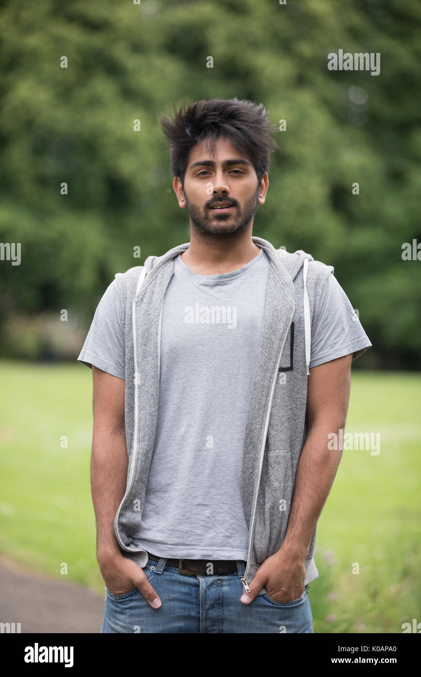 Happy indian man in jumper hi-res stock photography and images - Alamy