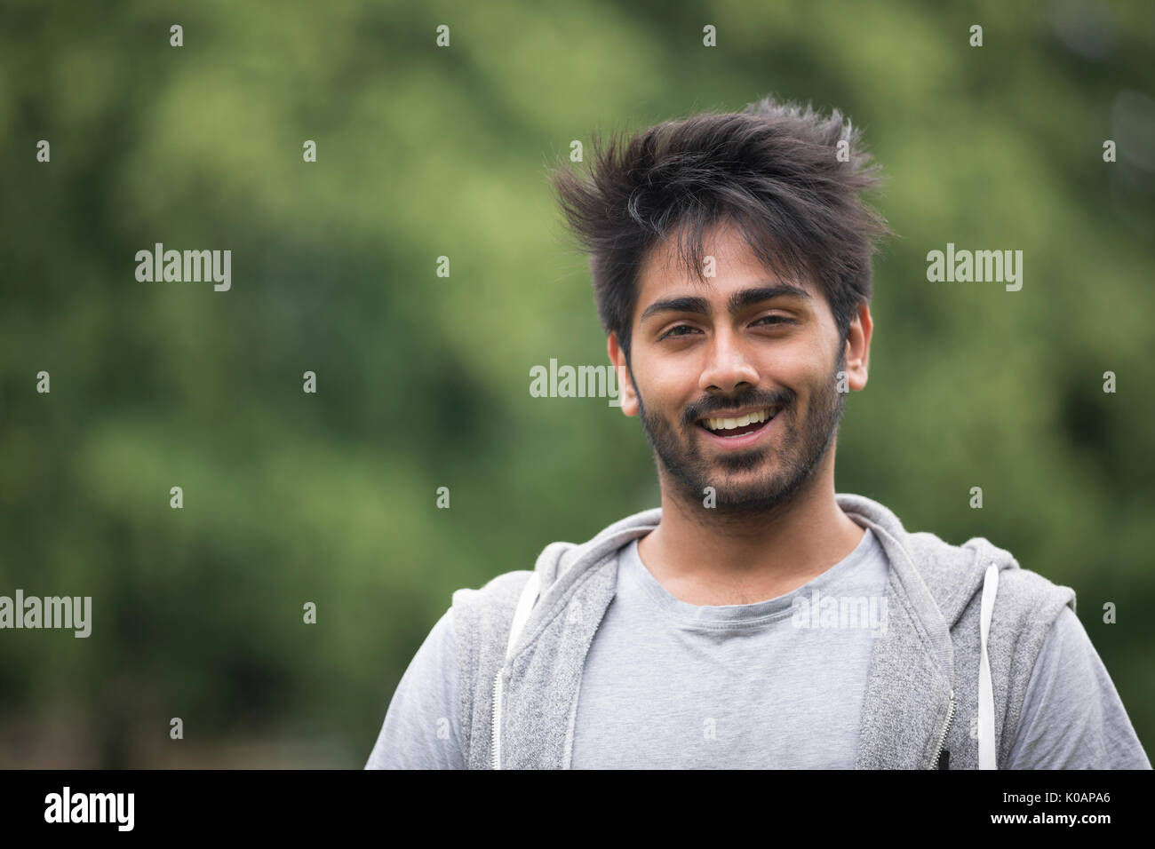 Portrait of a trendy urban Indian man. Urban man in city park Stock ...