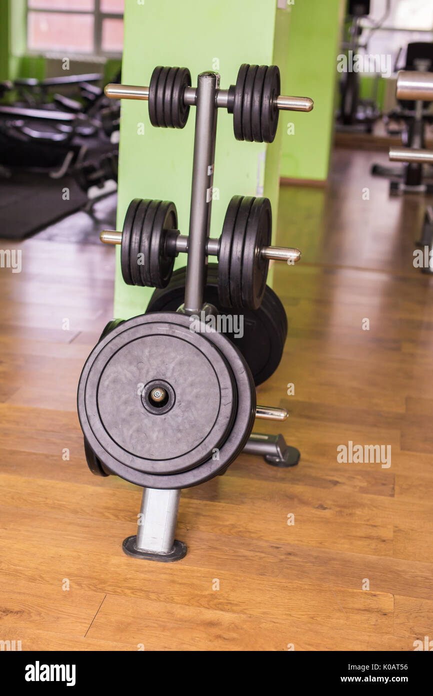 Sport, training and healthy lifestyle concept - gym interior with ...