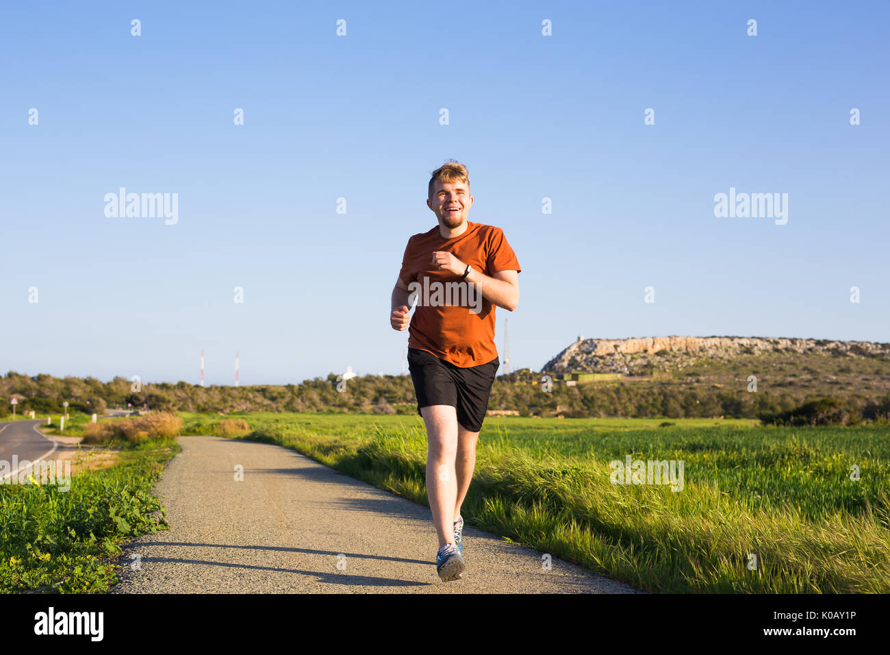 Man running outdoor sprinting for success. Male fitness runner sport ...