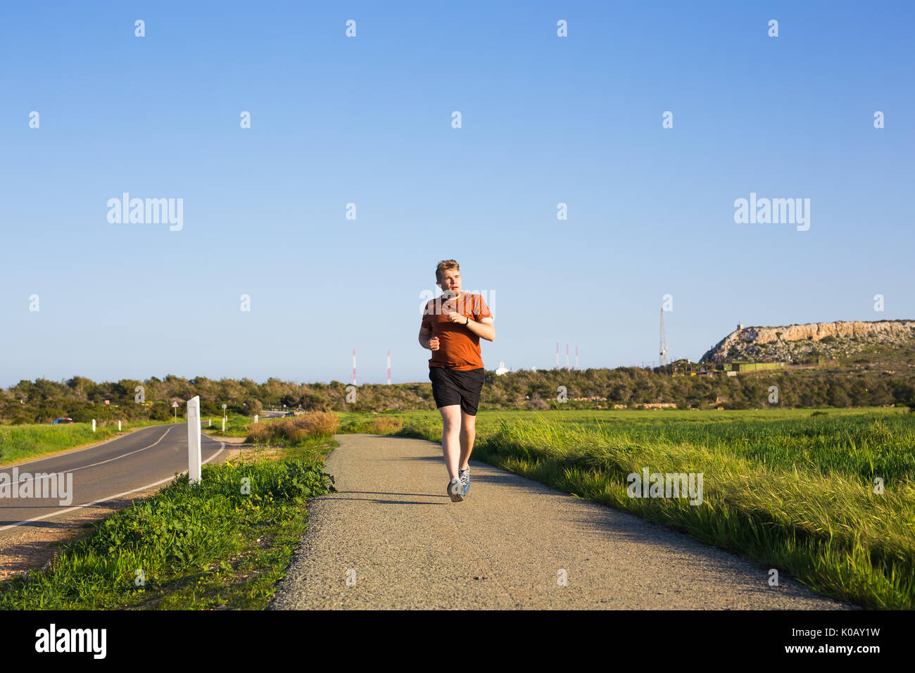 Man running outdoor sprinting for success. Male fitness runner sport ...