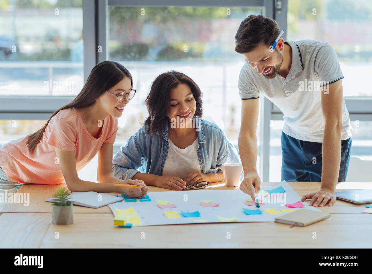 Joyful smart man explaining his idea Stock Photo - Alamy