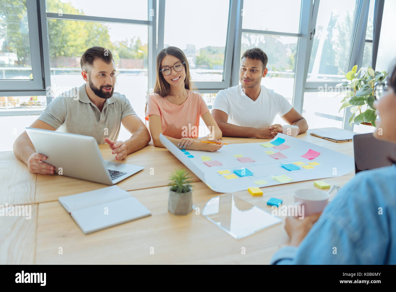 Pleasant creative people working together Stock Photo - Alamy