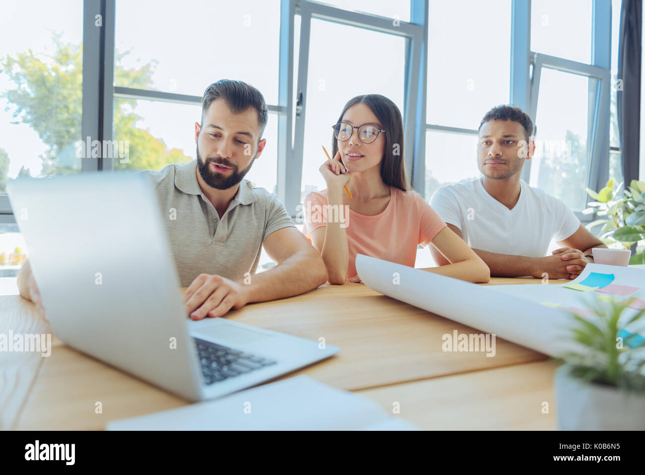 Smart good looking man presenting his project Stock Photo - Alamy