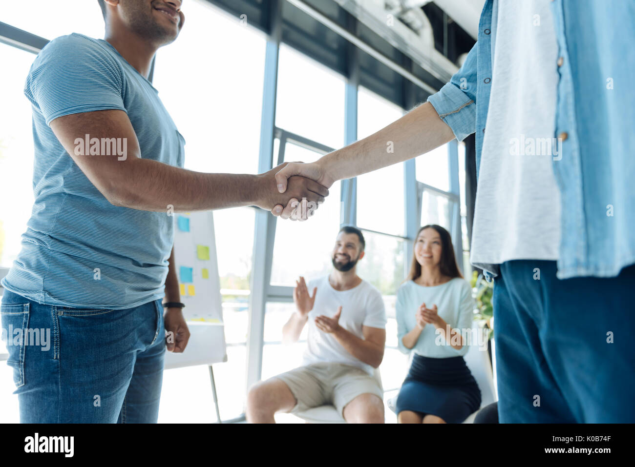Friendly handshake hi-res stock photography and images - Alamy