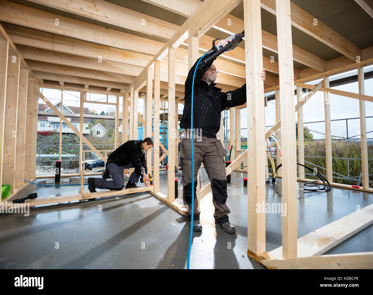 Professional Carpenters Drilling Wood At Site Stock Photo - Alamy