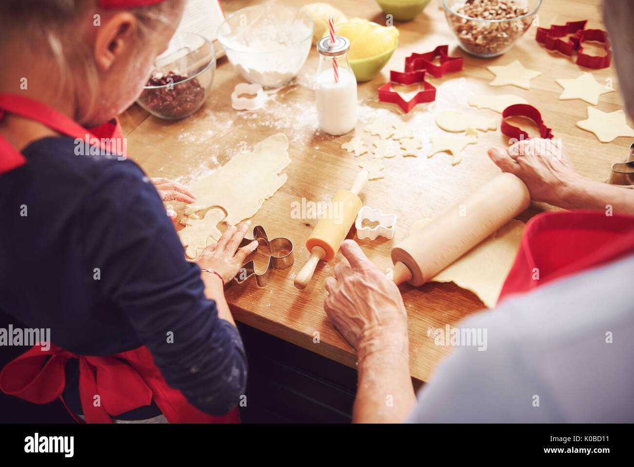Grandmother and granddaughter baking cookies hi-res stock photography ...