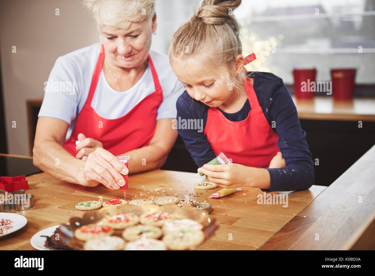 Grandma cooking with girl hi-res stock photography and images - Alamy