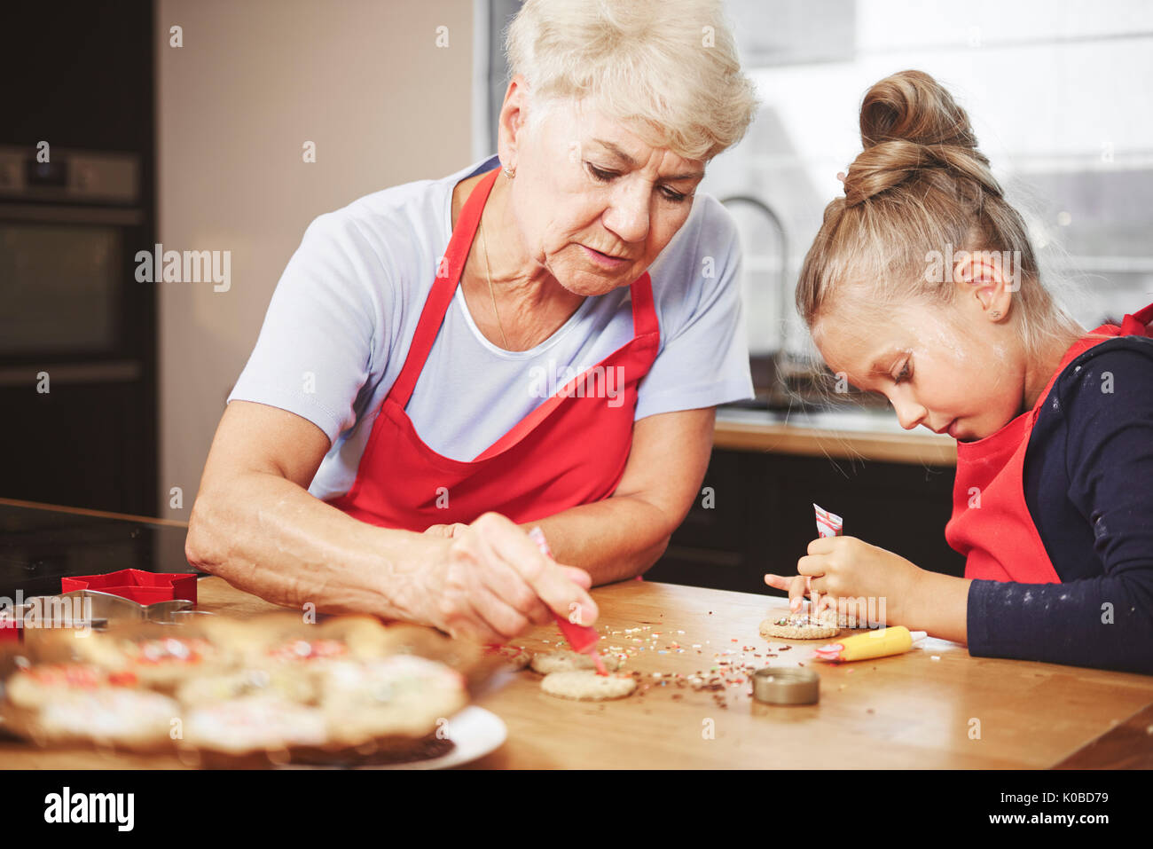 Grandma cooking with girl hi-res stock photography and images - Alamy