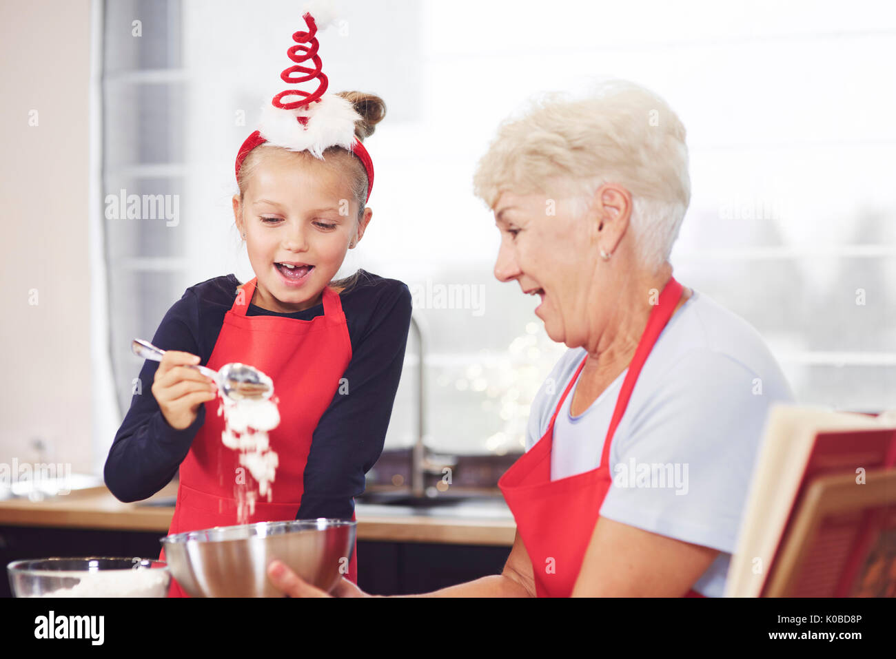 Grandma cooking with girl hi-res stock photography and images - Alamy