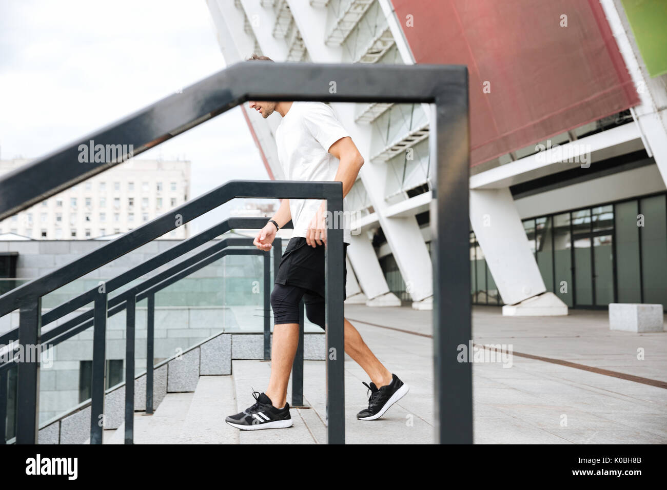 Man standing on ladder hi-res stock photography and images - Alamy