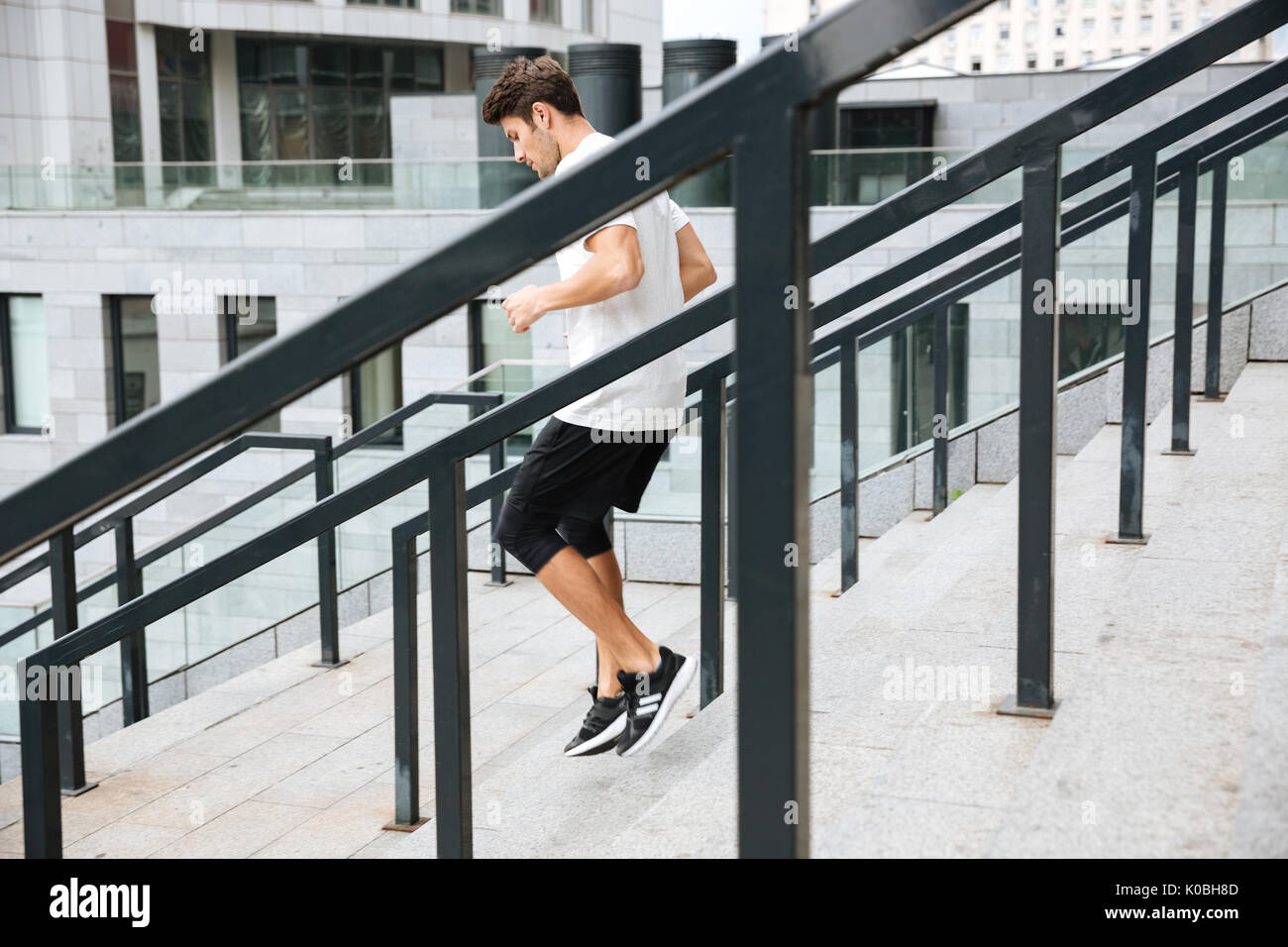 Man running downstairs hi-res stock photography and images - Alamy