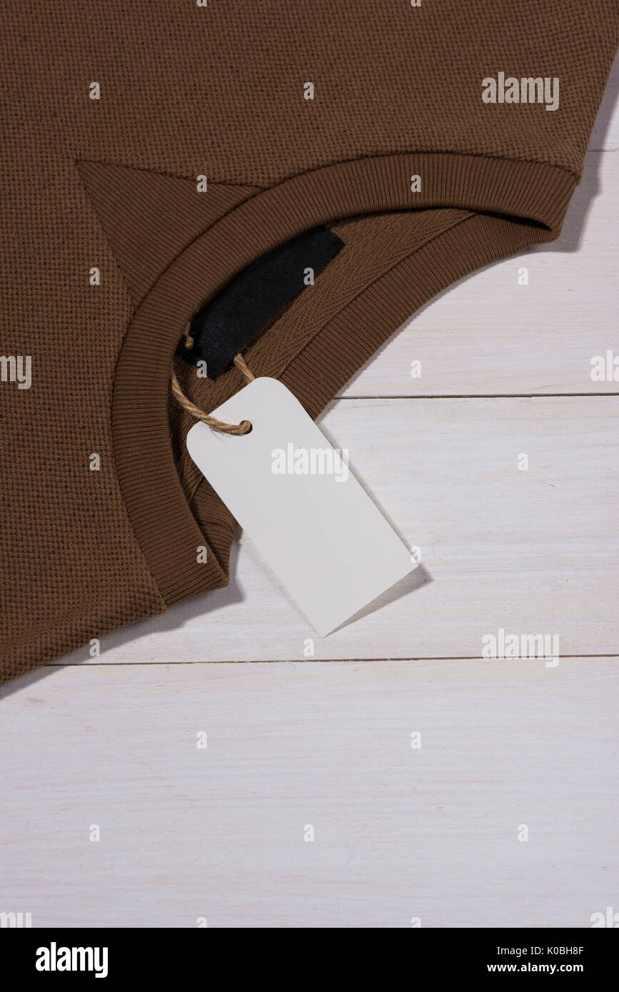 Shirt price tag. Rectangular tag is attached to a sweater Stock Photo ...