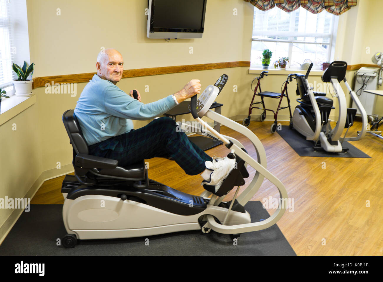 Senior Physical Therapy Patient on Recumbent Stepper Stock Photo - Alamy