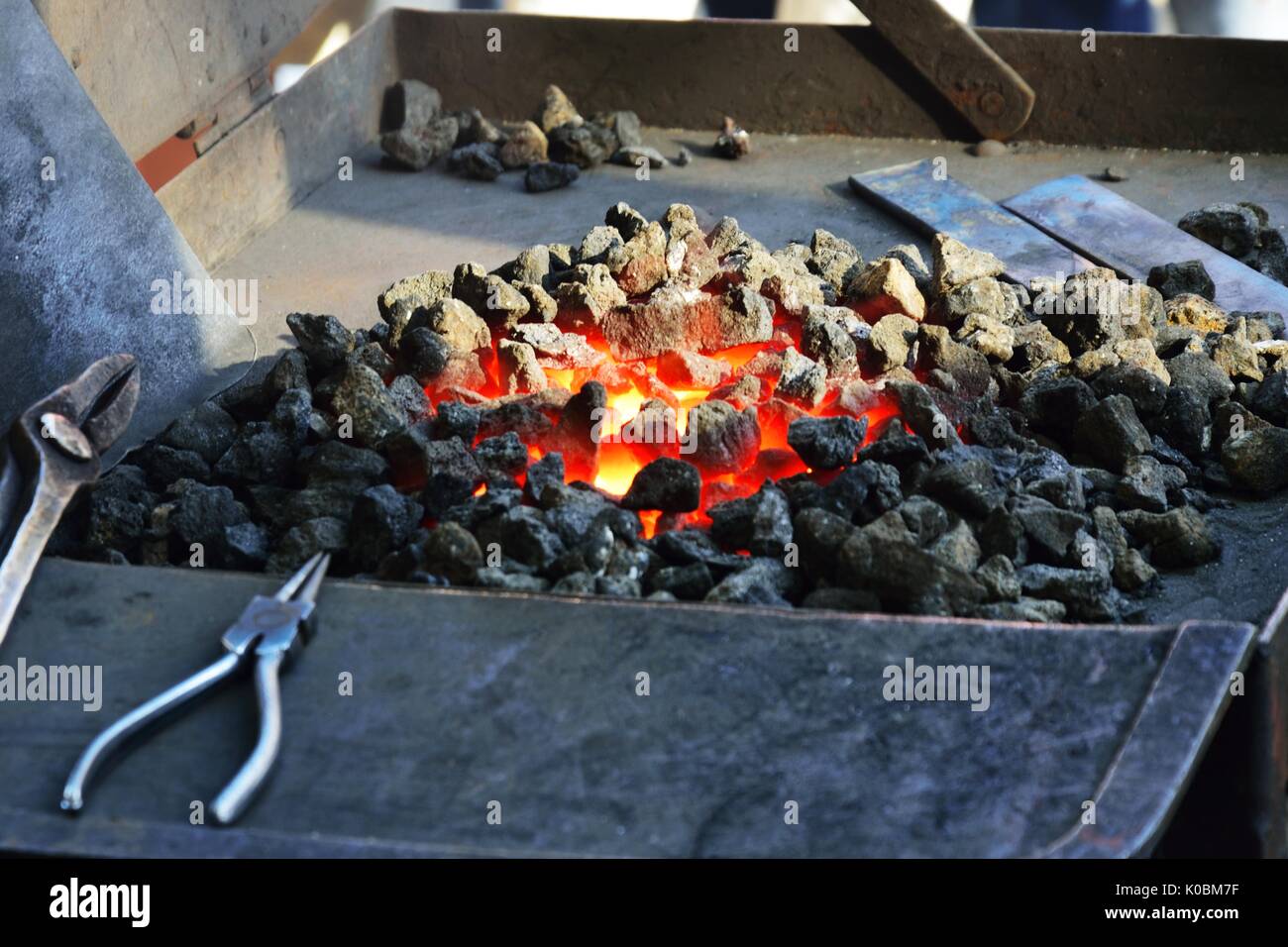 Small fire for forging metal Stock Photo - Alamy