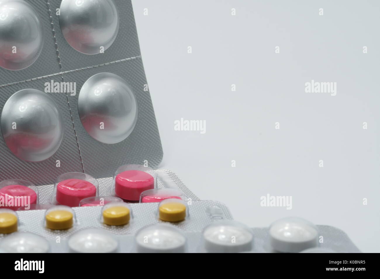 Tablets in blister pack on white background Stock Photo - Alamy