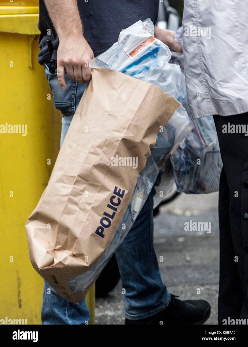 Police evidence is bagged outside an address in Lewisham, south east ...