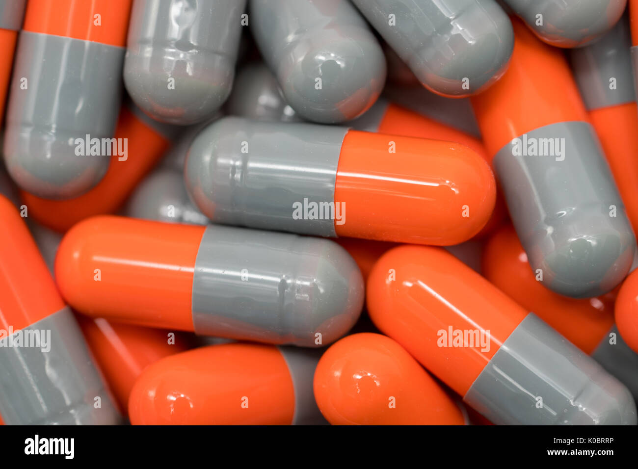 Top view of orange, grey, capsule pills Stock Photo - Alamy