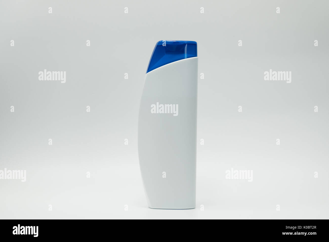 Cosmetic bottle with blue cap isolated on white background Stock Photo ...