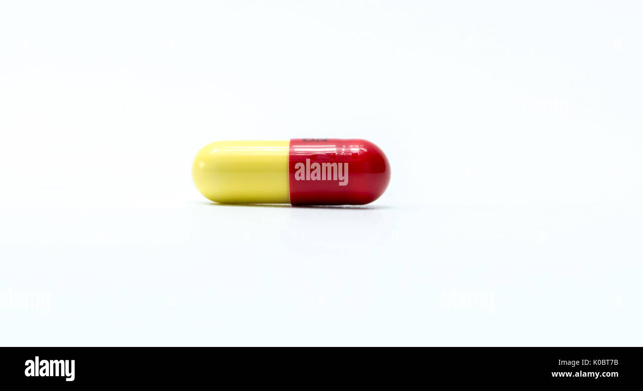 Red, Yellow antibiotic capsule pills isolated on white background with ...