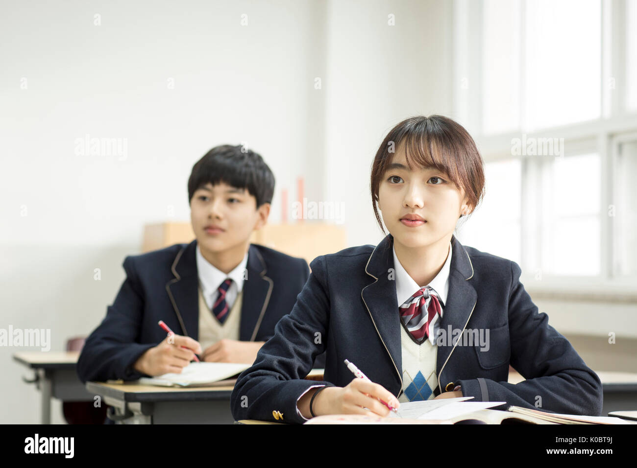 Portrait of school students concentrating on class Stock Photo - Alamy