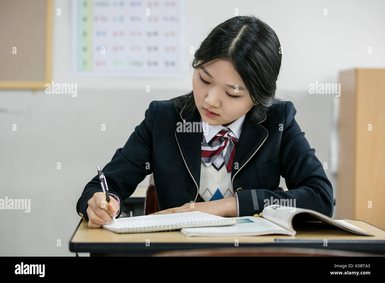 Portrait of school girl concentrating on study Stock Photo - Alamy