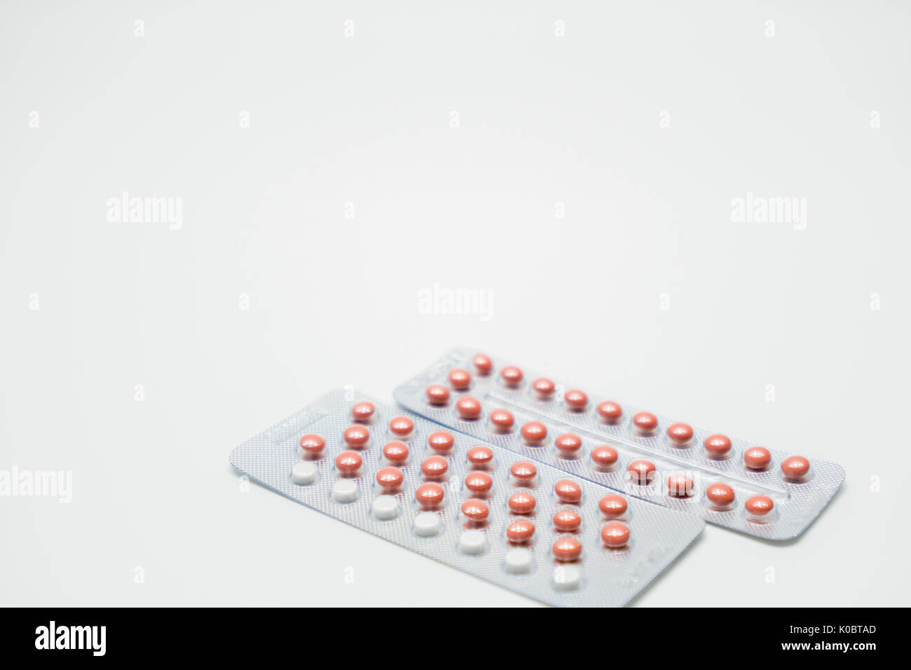 Contraceptive pills on white background Stock Photo - Alamy