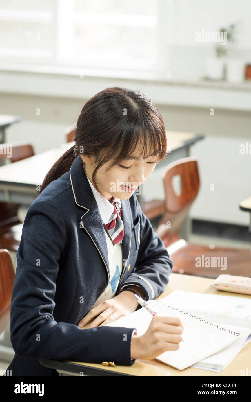 Side view of school girl taking class Stock Photo - Alamy