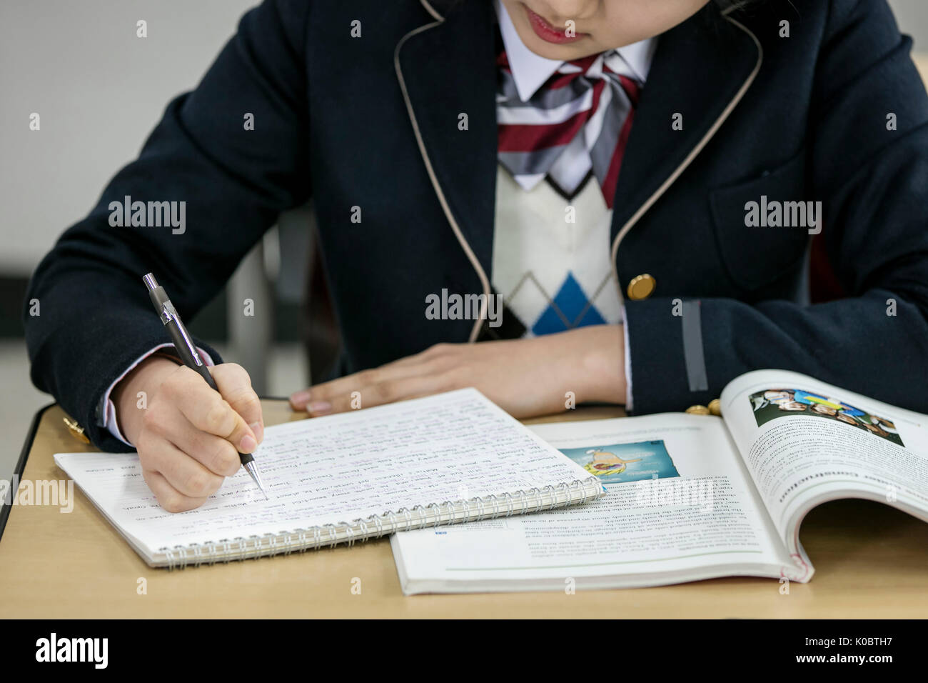 School girl studying hard Stock Photo - Alamy