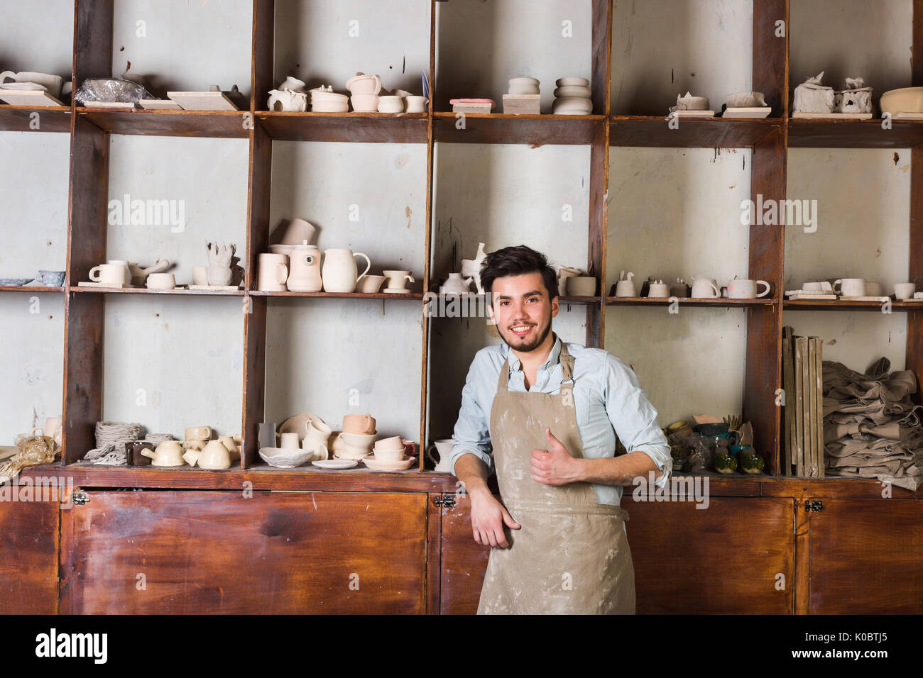 pottery, tools, ceramics art concept - happy handsome young male ...
