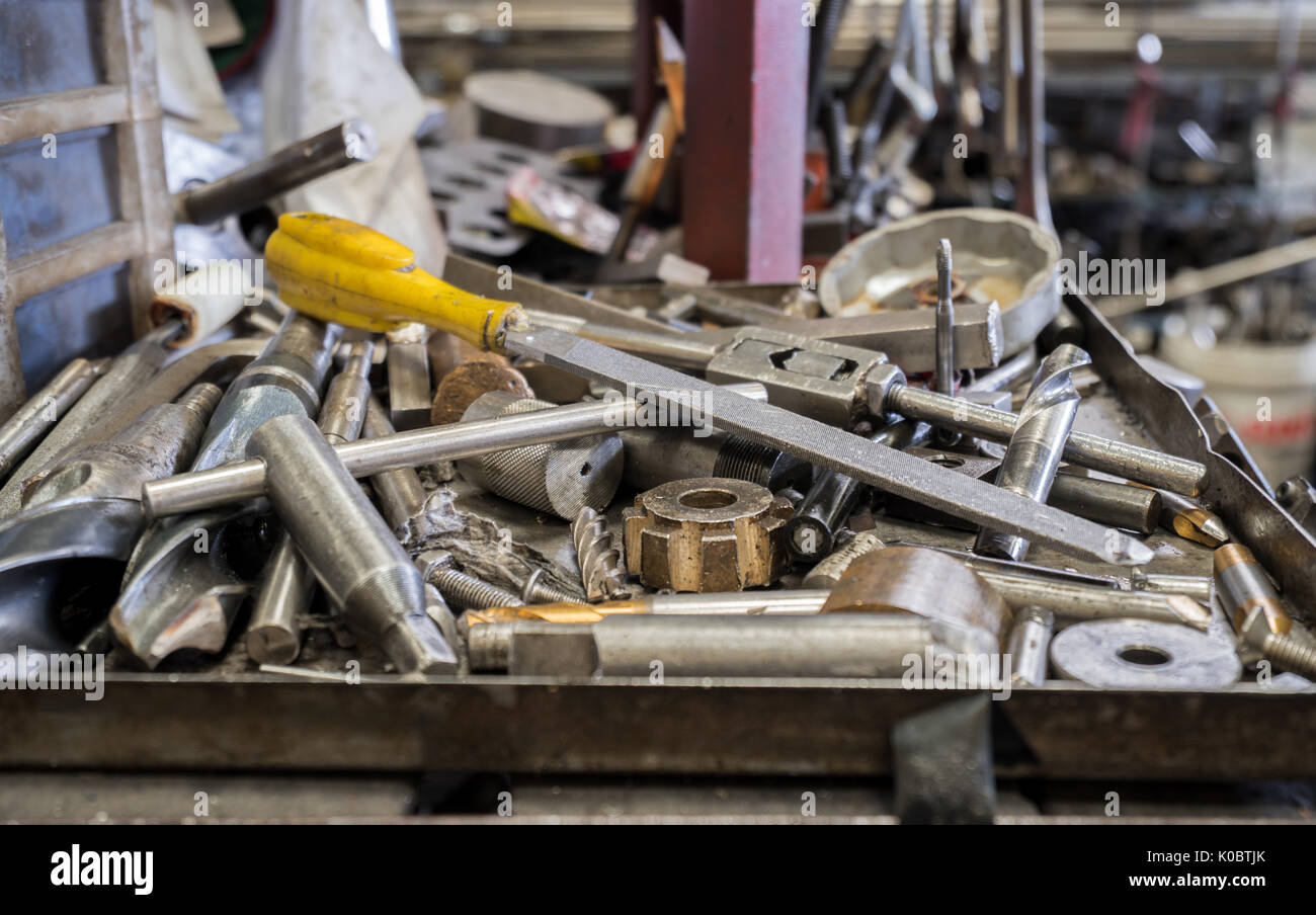 Tools on metal tray with untidy tools at background Stock Photo - Alamy