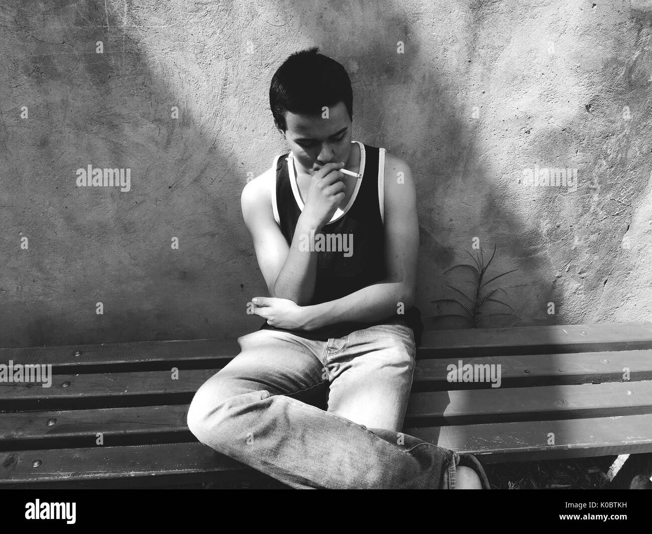 Teenage boy with cigarette photo black and white Stock Photo - Alamy