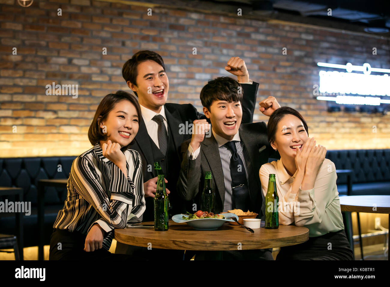 Smiling business people having get-together Stock Photo - Alamy