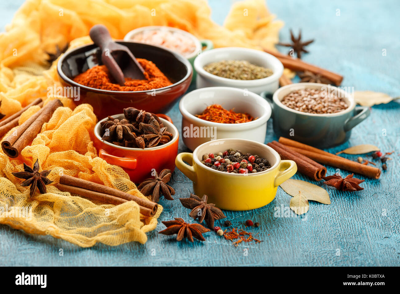 Dry colorful spices and condiments anise, paprika, saffron, pepper ...