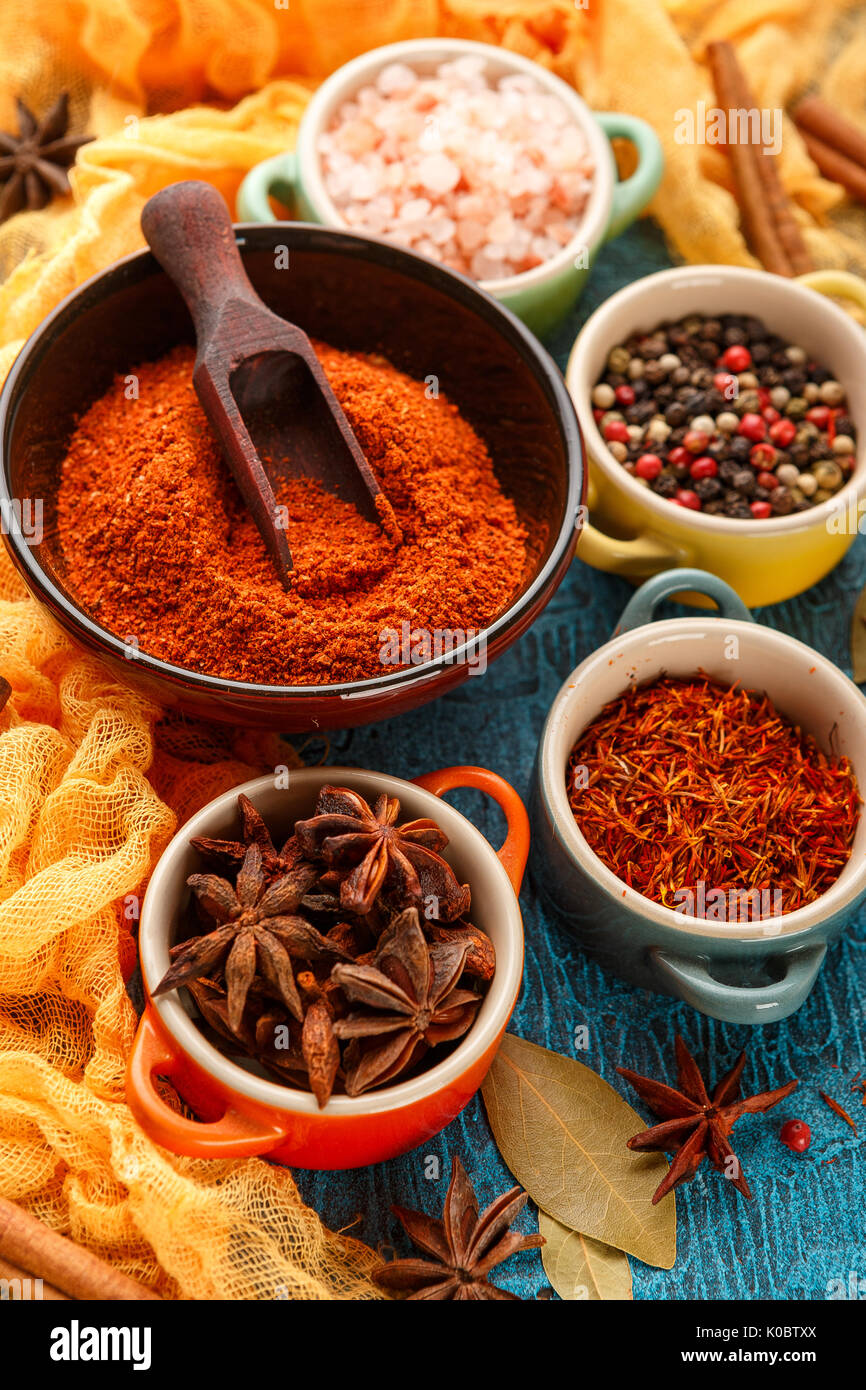 Dry colorful spices and condiments anise, paprika, saffron, pepper ...