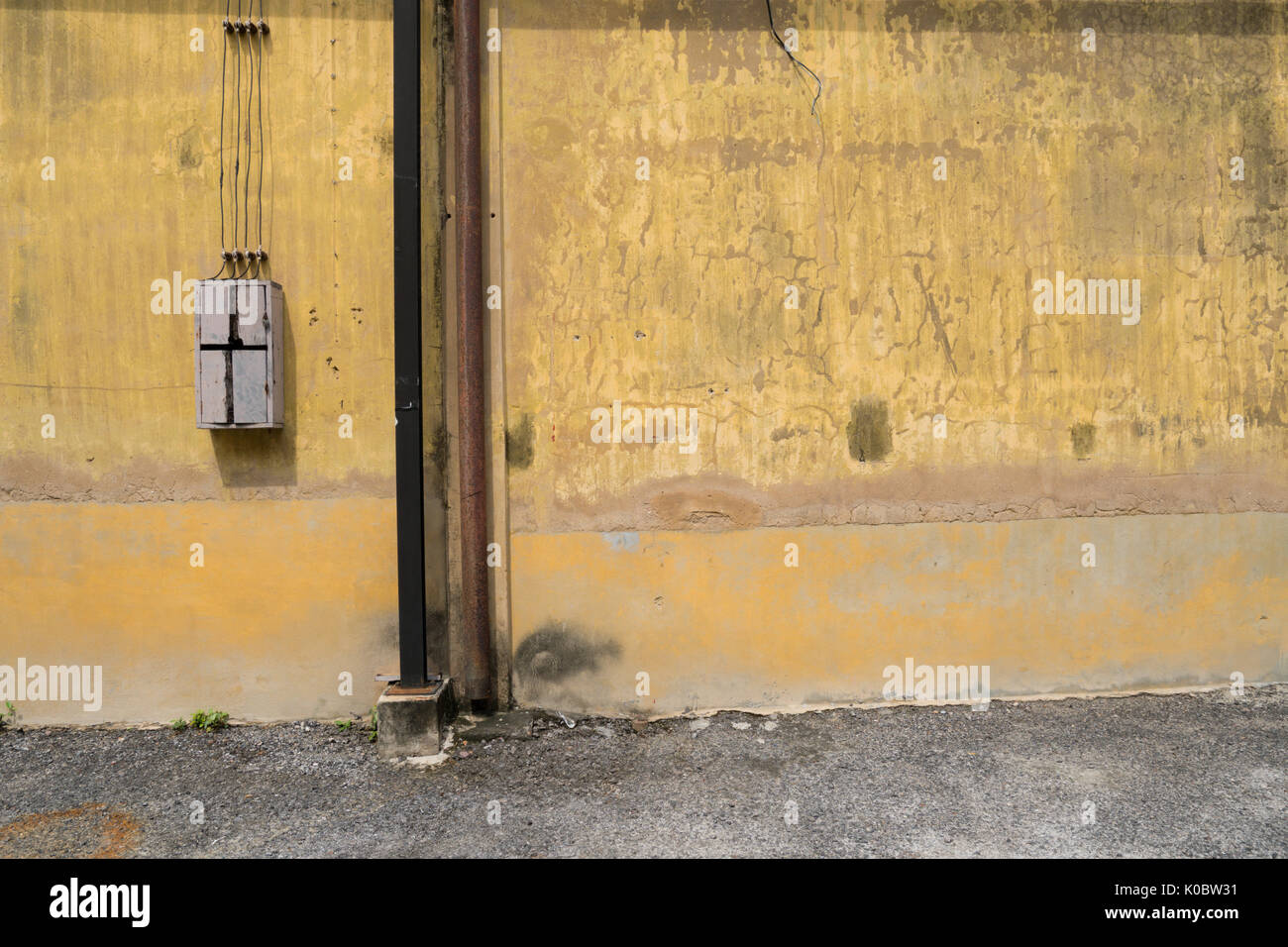 Texture of old yellow vintage wall of industrial factory with rusted ...