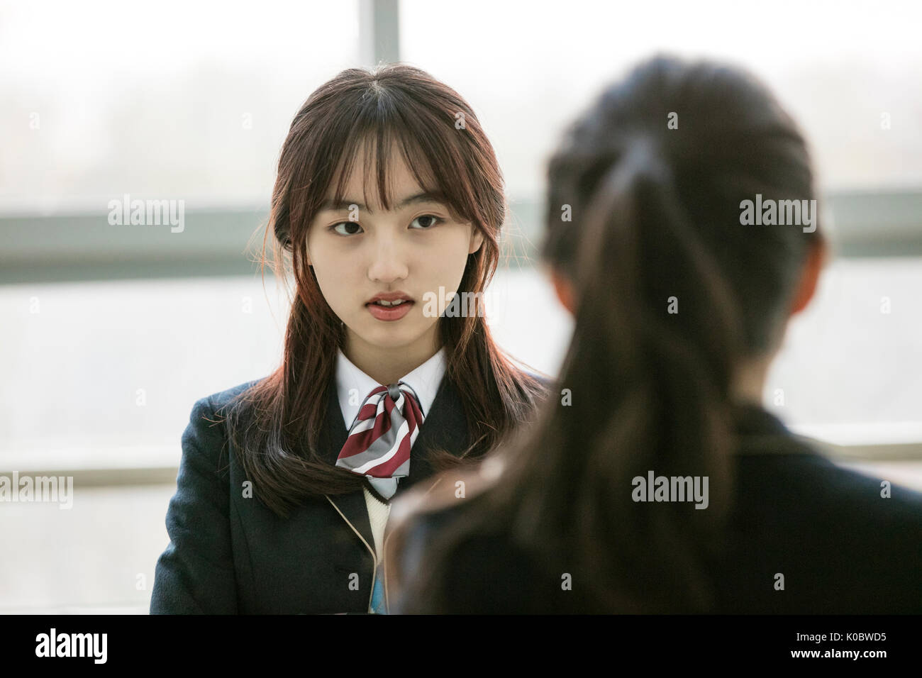 Portrait of school girls with expressionless faces Stock Photo - Alamy