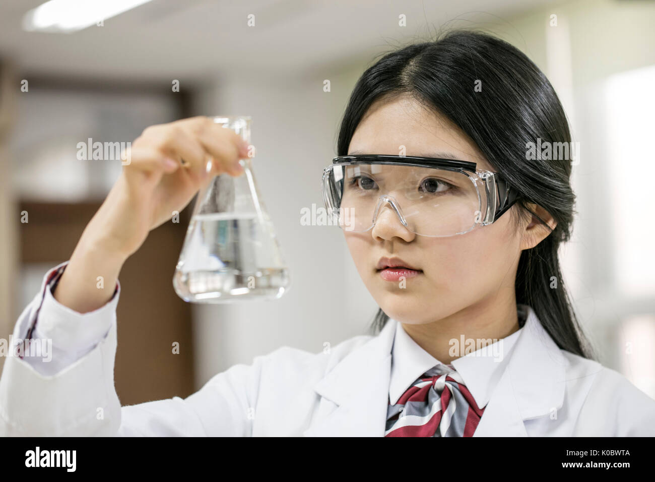 Portrait of school girl learning science Stock Photo - Alamy