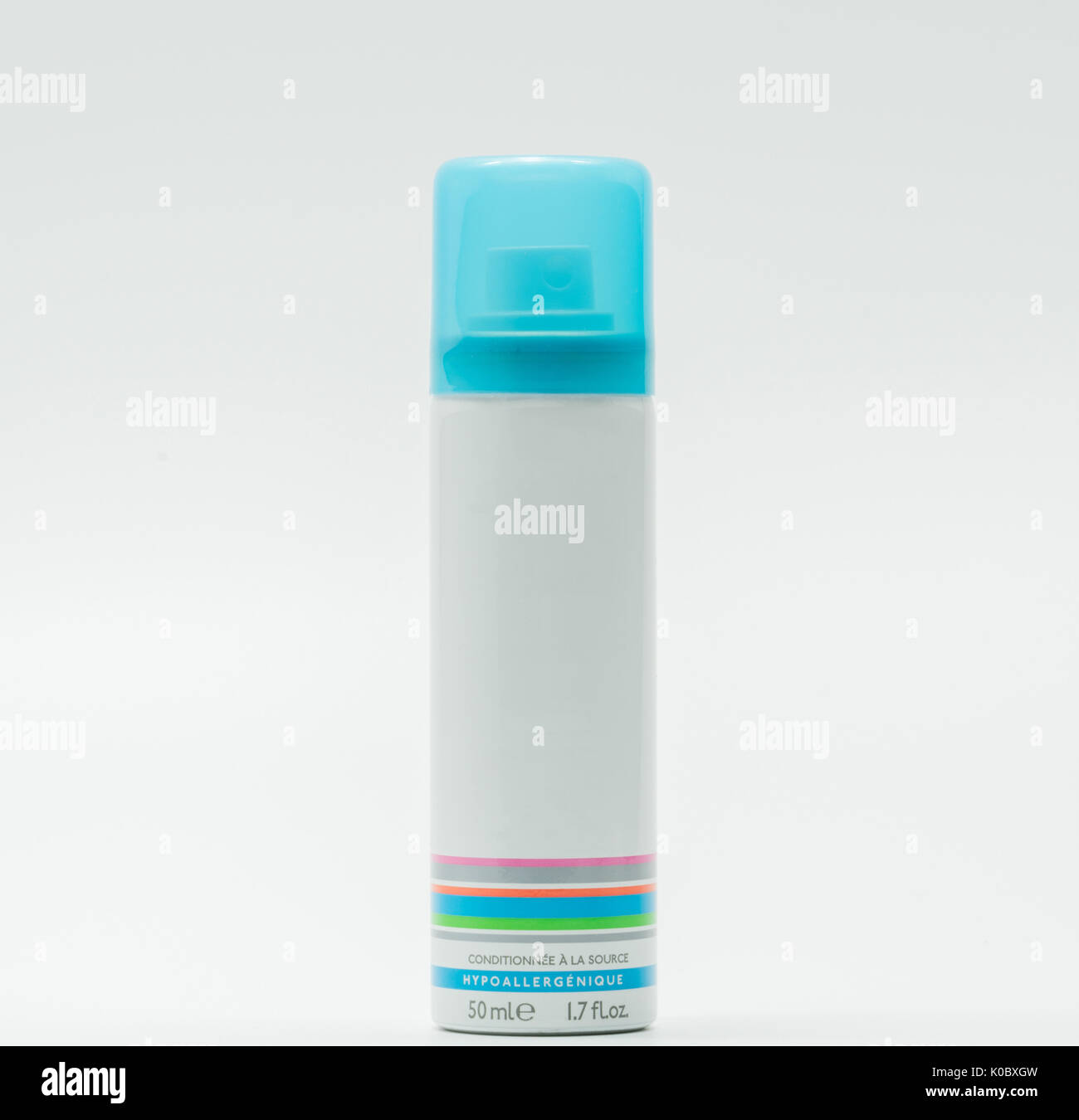 Facial spray bottle and blue cap with blank label isolated on white ...