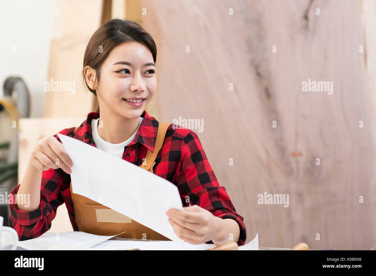 Portrait of smiling female furniture designer Stock Photo - Alamy