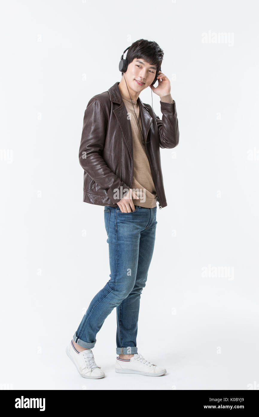 Young adult male listening music hi-res stock photography and images ...