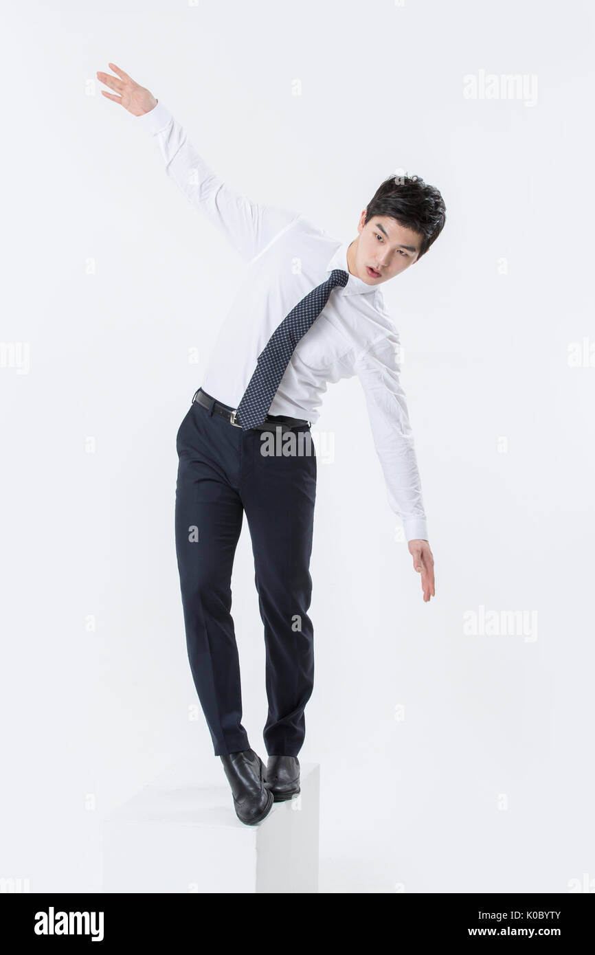 Person trying to balance hi-res stock photography and images - Alamy