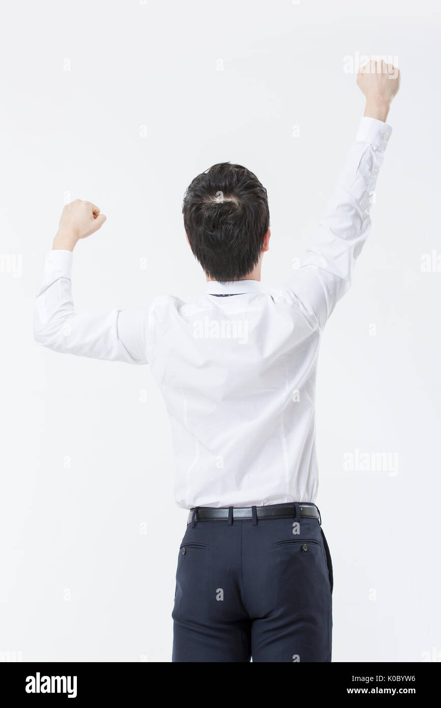 Back of young businessman cheering Stock Photo - Alamy