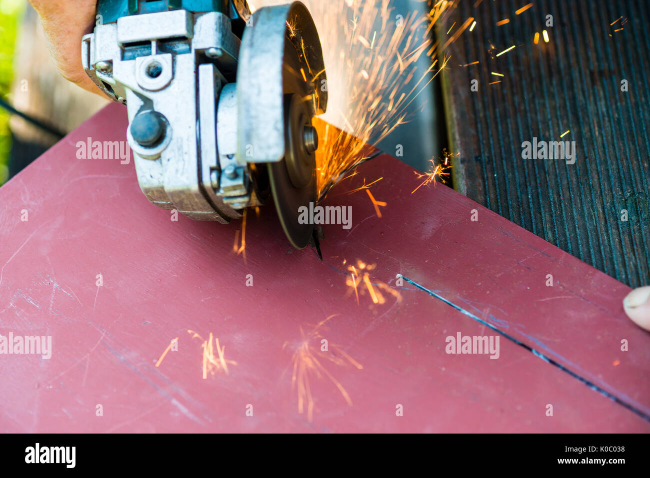 metal sawing with grinder close up Stock Photo - Alamy