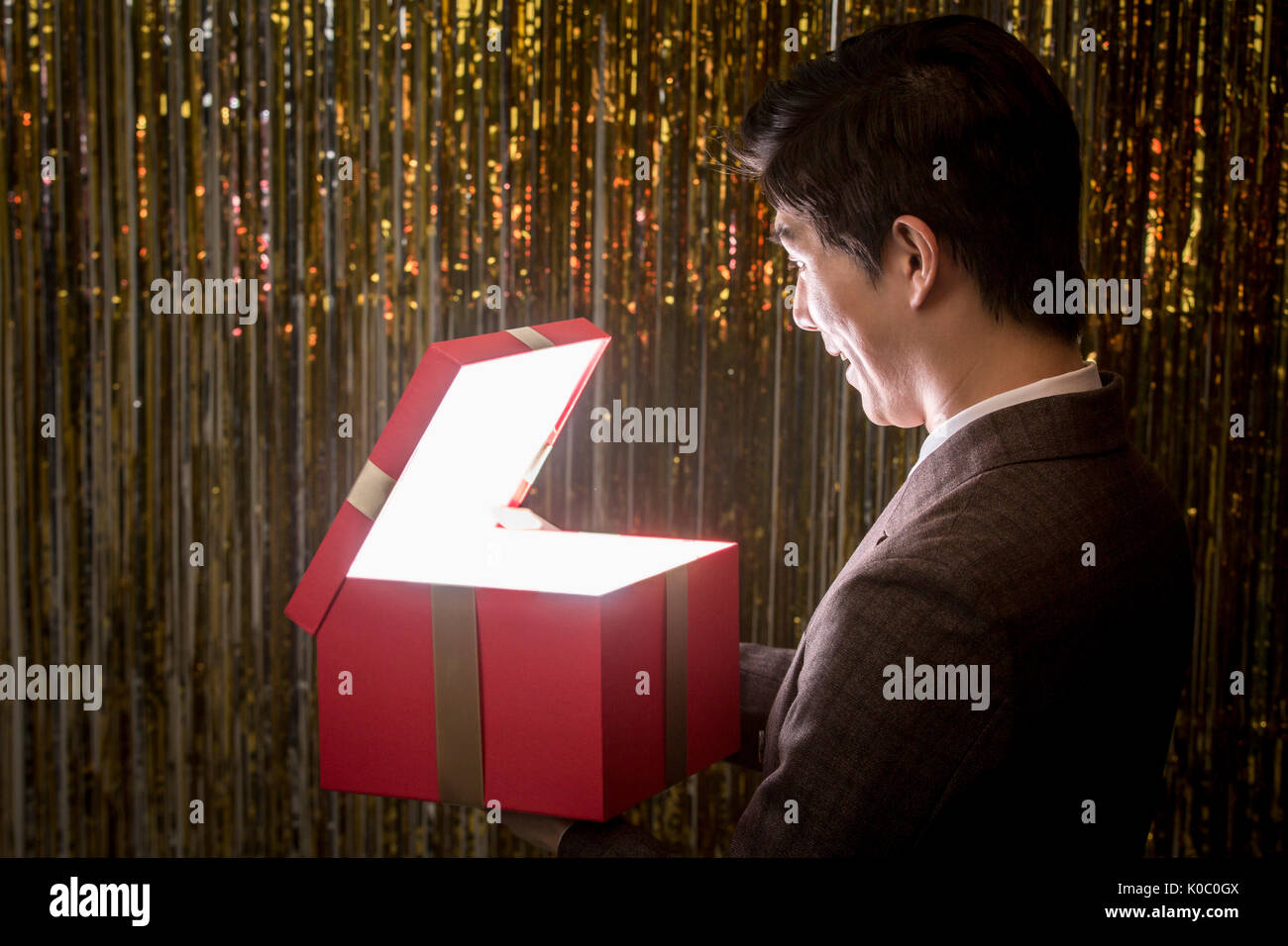 Surprised man present hi-res stock photography and images - Alamy