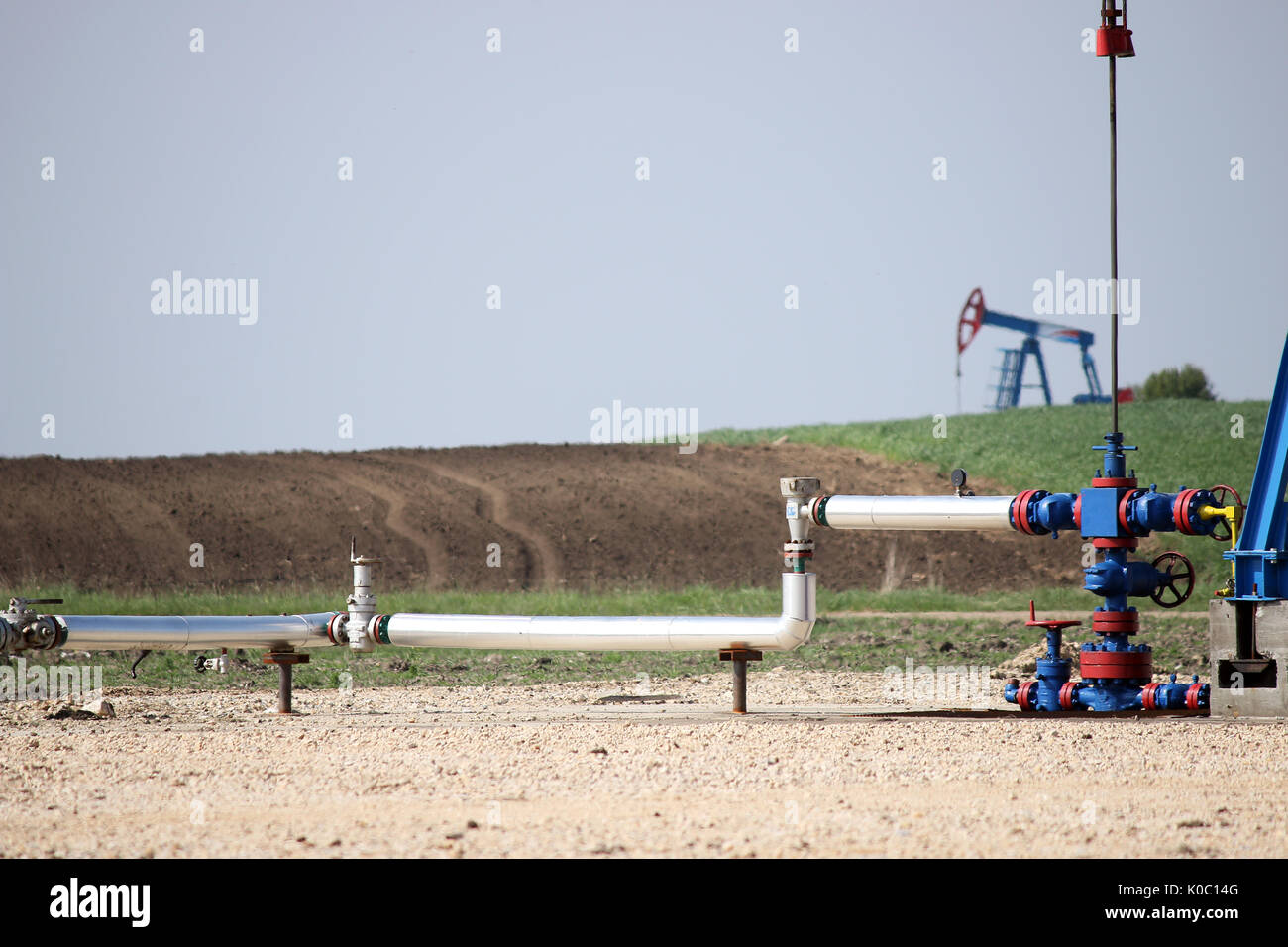 pipeline and oil pump jack on oilfield Stock Photo - Alamy