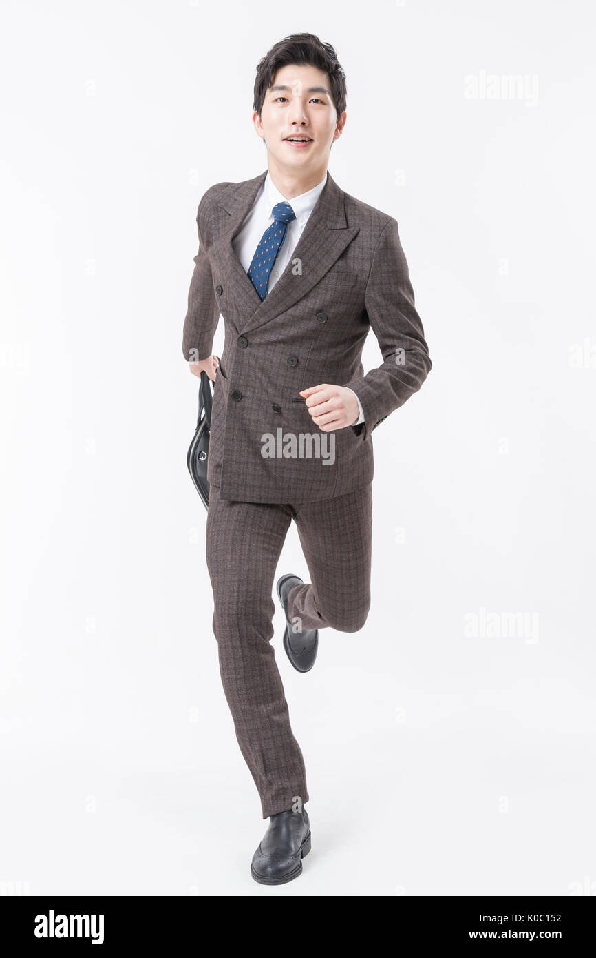 Man in suit briefcase running hi-res stock photography and images - Alamy