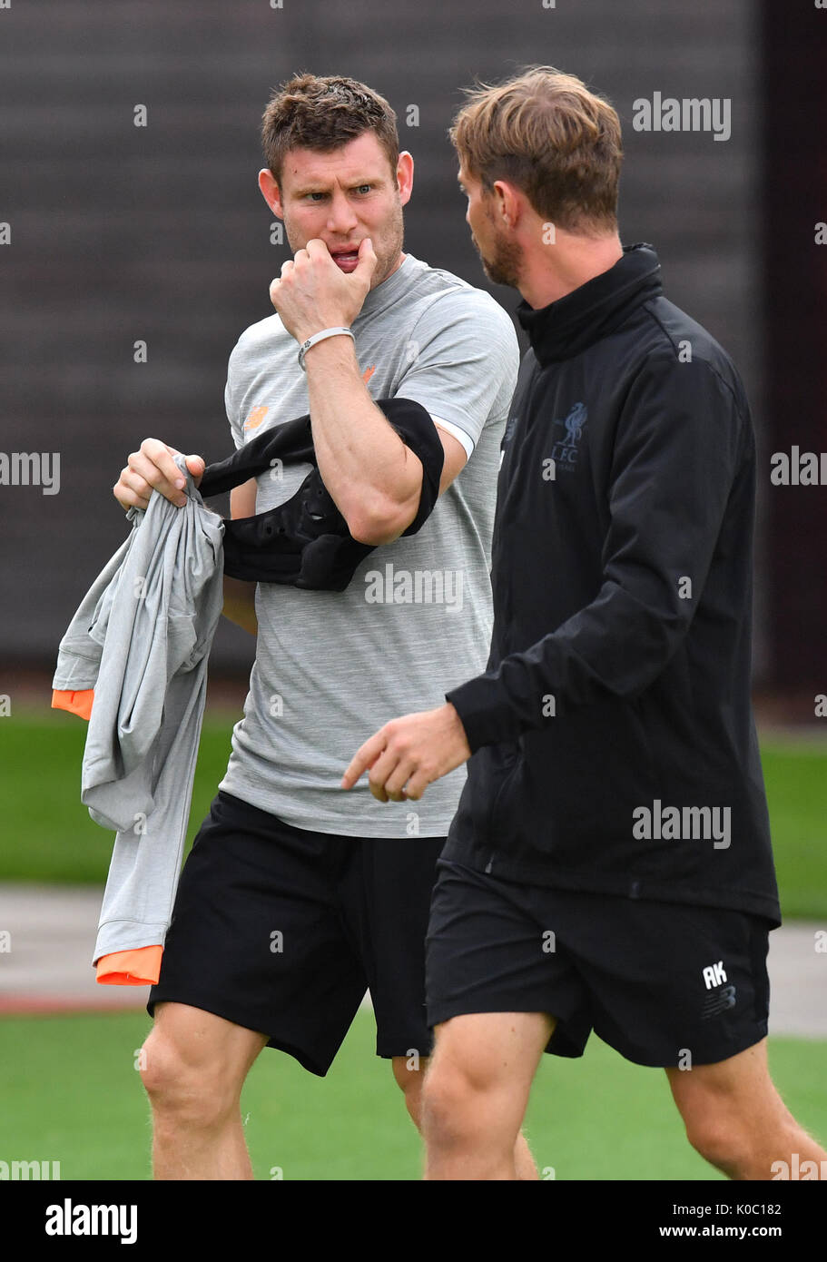 Liverpool's James Milner (left) during a training session at Melwood ...