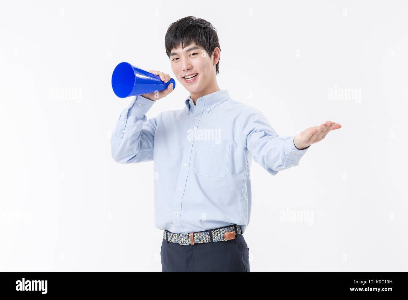 Young man holding megaphone hi-res stock photography and images - Alamy