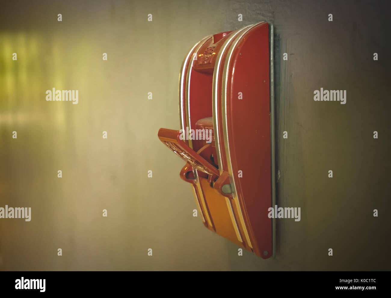 Orange fire alarm Stock Photo - Alamy
